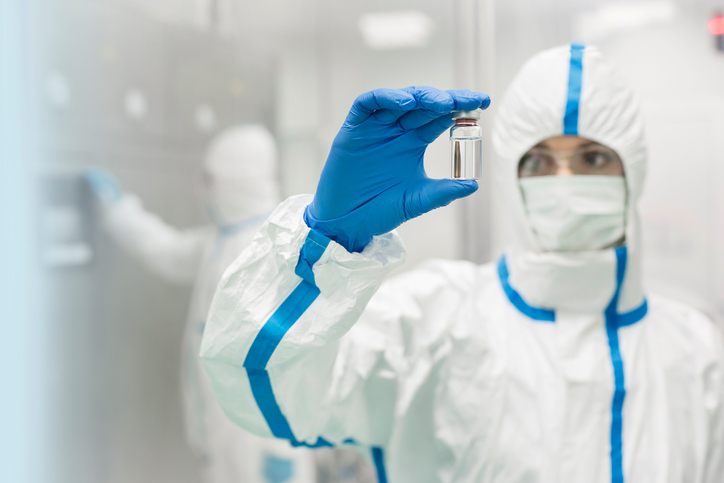 Scientist in clean suit - Environmental Health and Safety